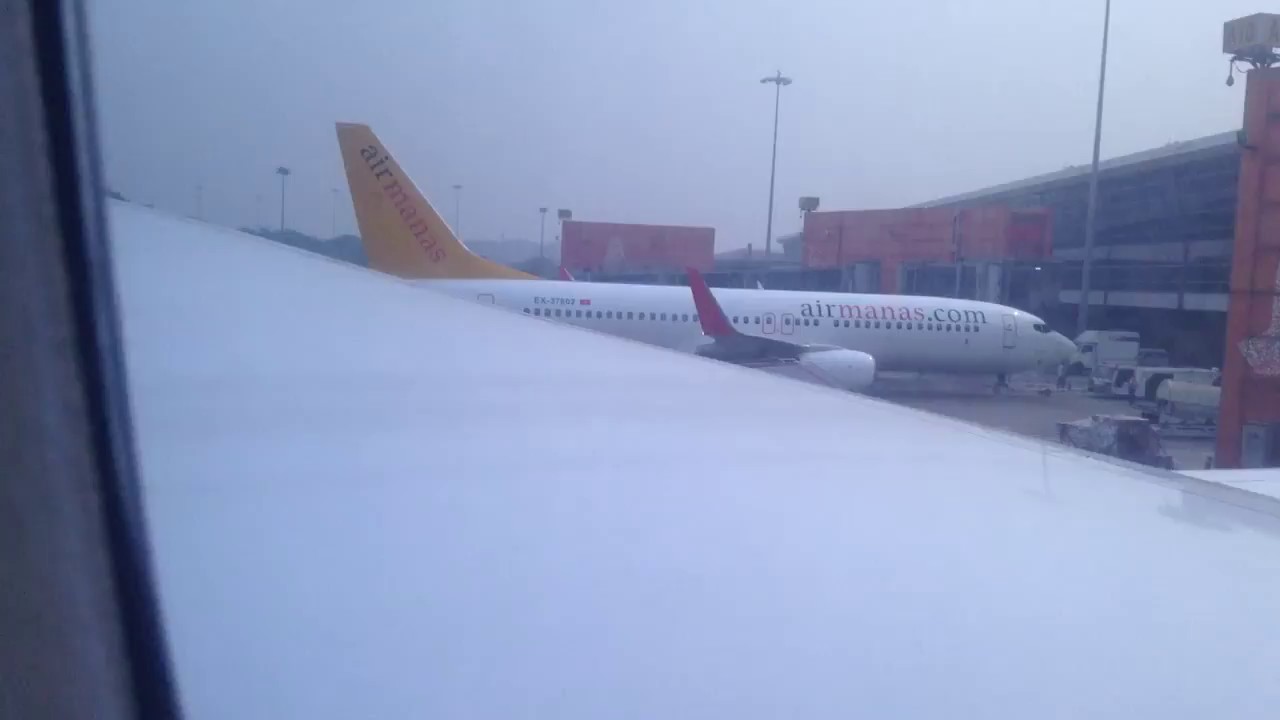 Air Manas 737 pushing back from gate 09 (As viewed inside from another ...