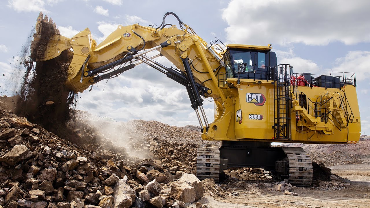 Caterpillar 6060 FS loads Soil Into Cat Trucks - YouTube