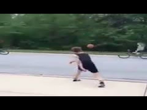 Boy Knocks Girl Off Bike With Basketball (VIDEO)