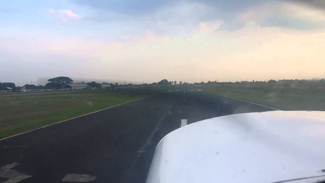 cockpit view of Cessna 152 Landing at Omni Aviation field Clark - YouTube