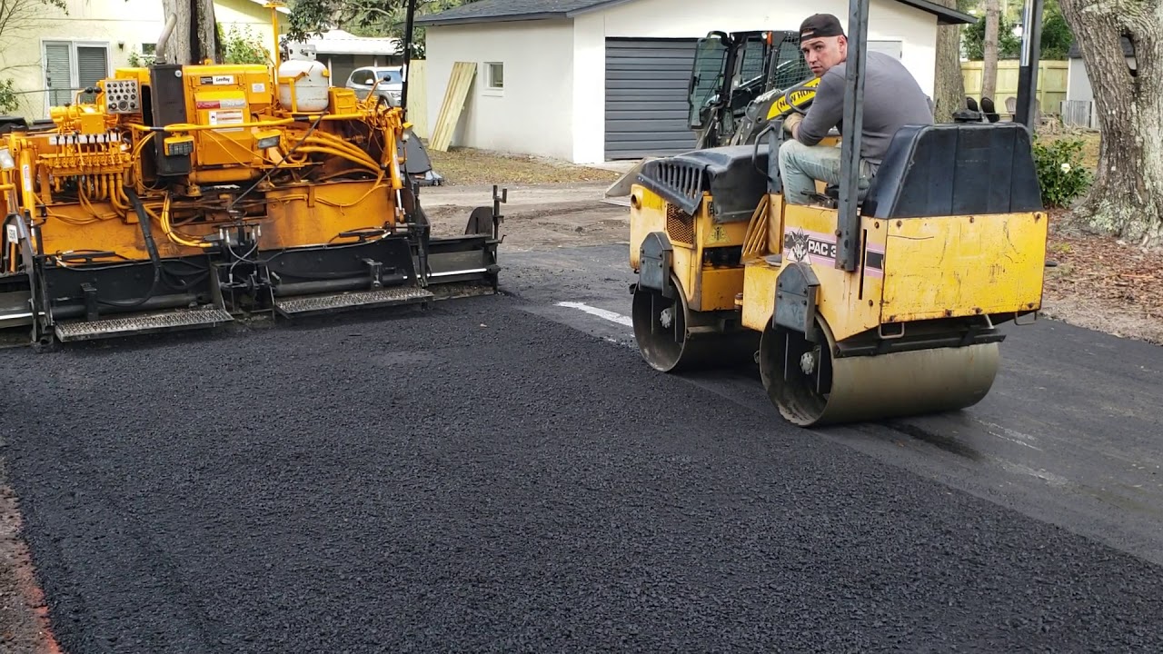Spreading and Rolling a New Asphalt Driveway - YouTube