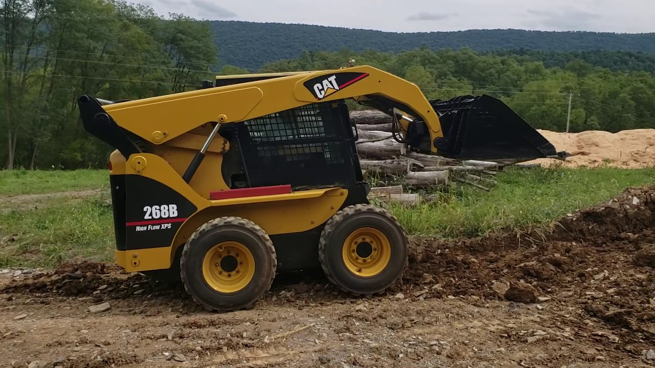 Cat 268B High-Flow Skid Steer Loader: Running, operating, Digging Dirt ...