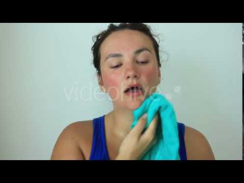 Woman Wiping Face With Exercise Towel - YouTube