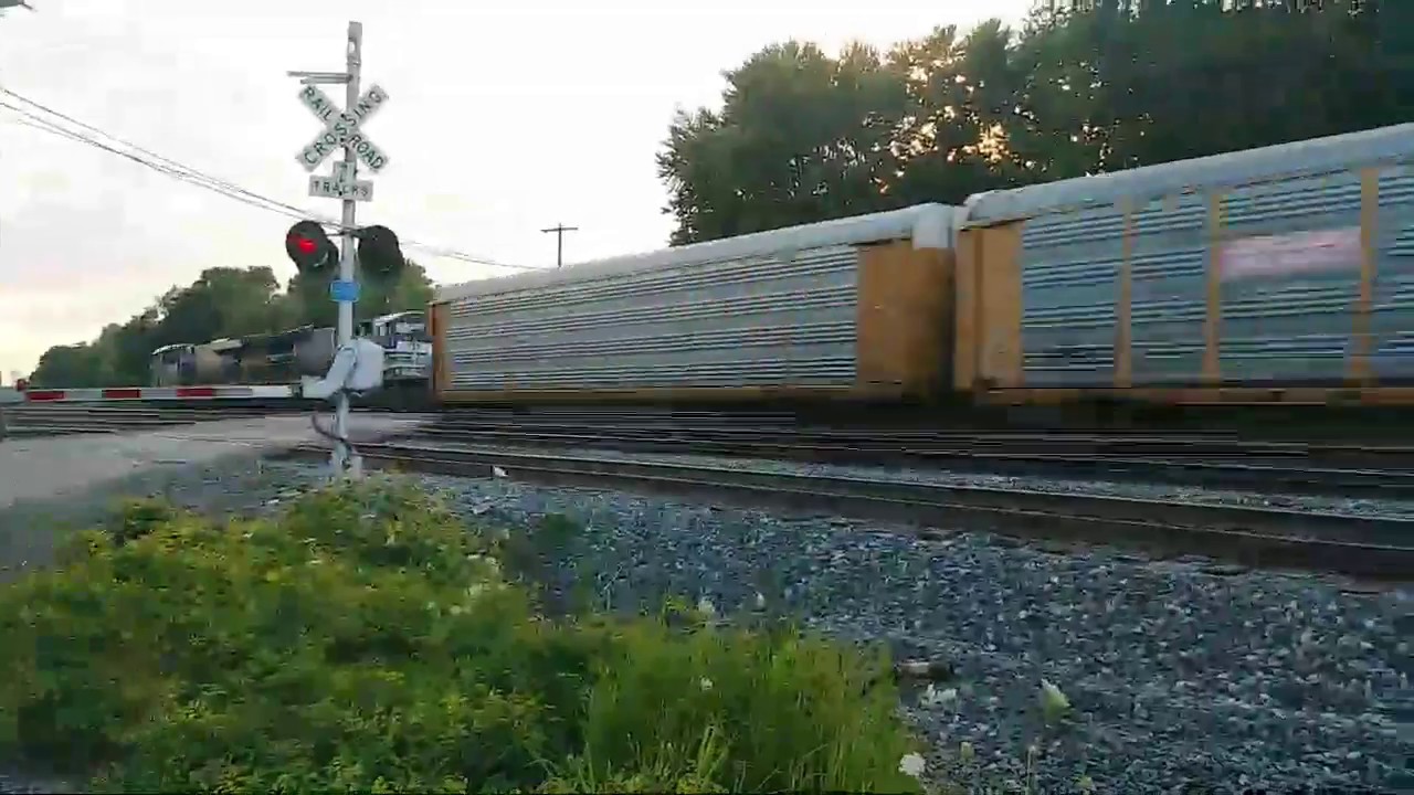 Car Goes Around Gates With Train Approaching - YouTube