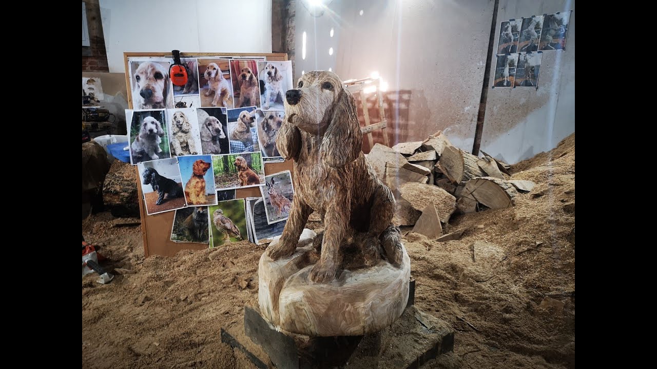 Chainsaw carving a Spaniel from log to dog - YouTube