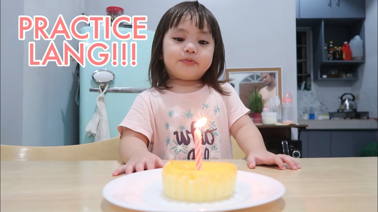 Practicing blowing the birthday cake - YouTube