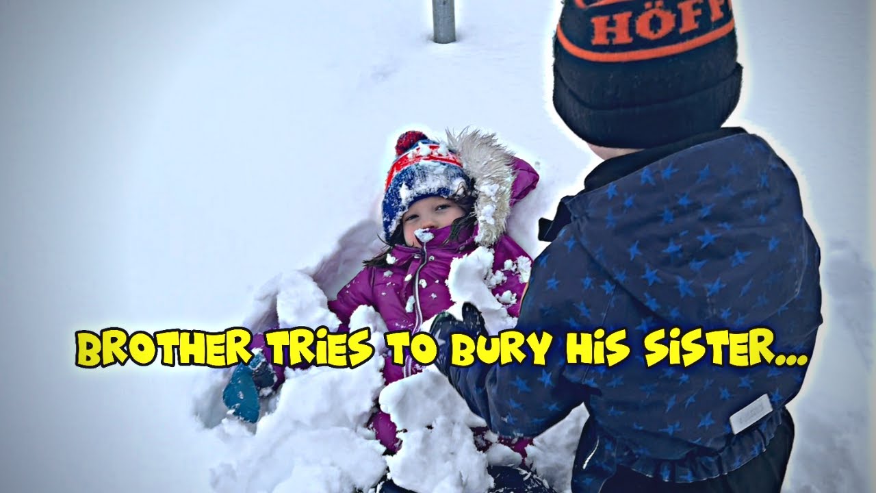 Brother tries to bury sister in the snow... what happens? - YouTube
