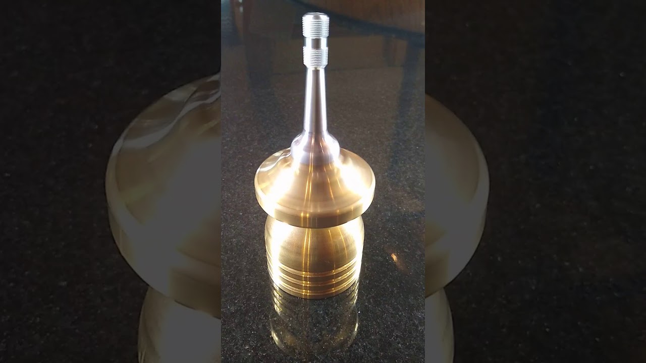 Giant brass spinning top on a stand - YouTube