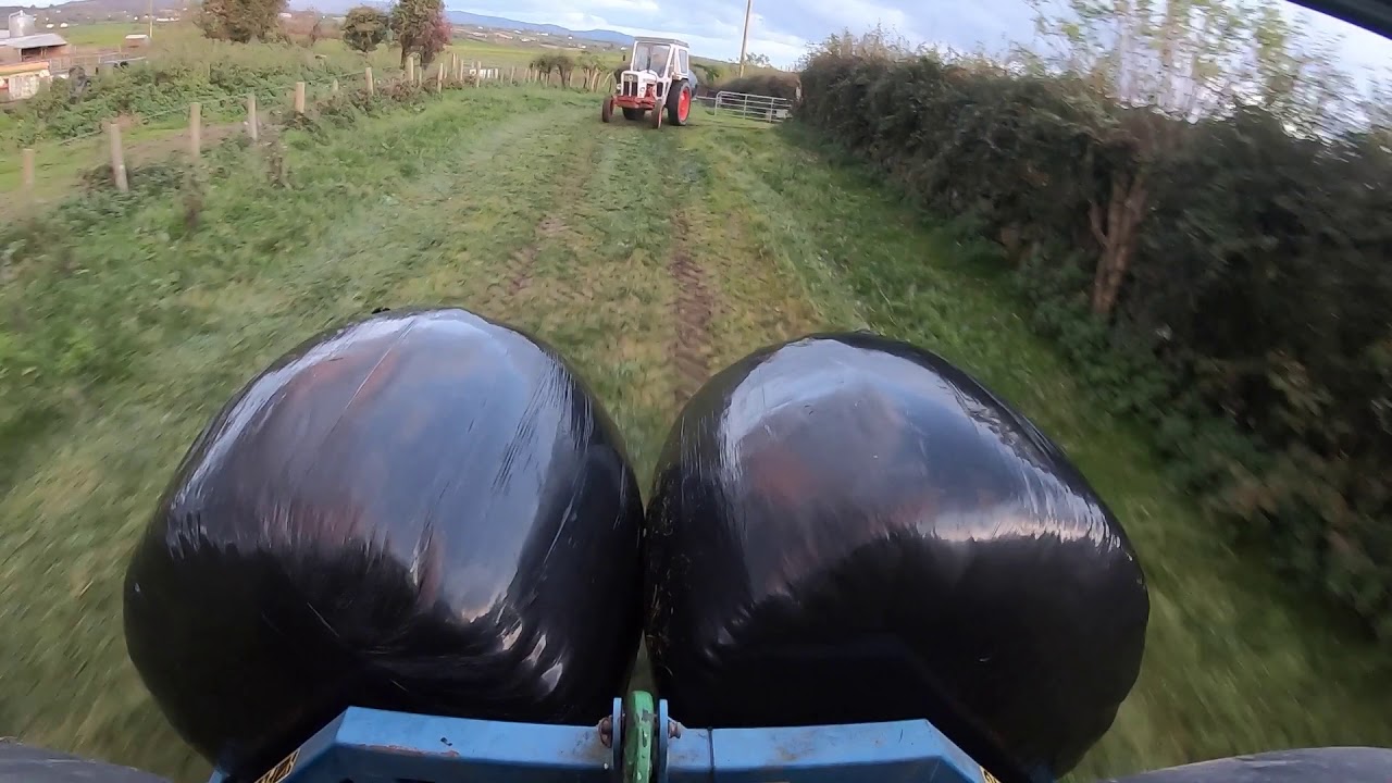 OCTOBER BALING AND STACKING OF ROUND BALES - YouTube