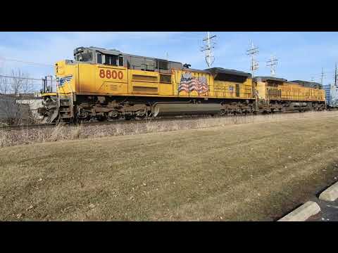 UP 8800 and UP 6166 lead a manifest with UP 2546 as the mid DPU west in Geneva IL - YouTube