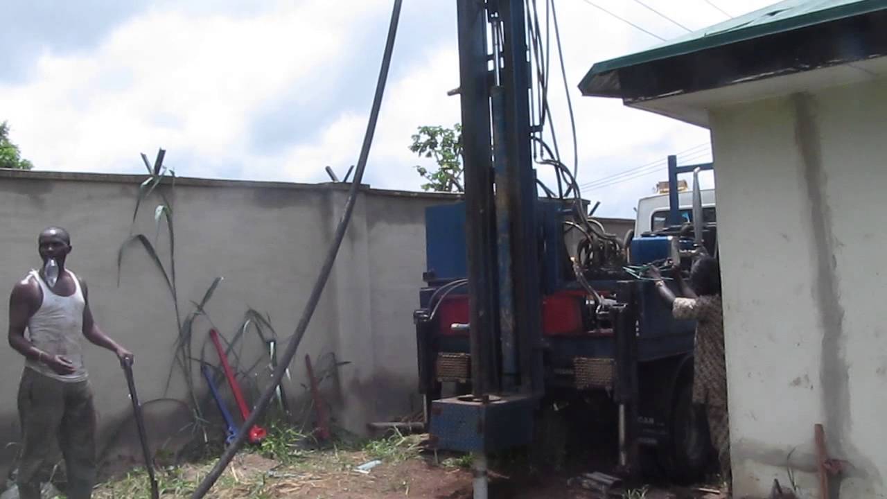 Mechanised borehole drilling using percussion method with compressed ...