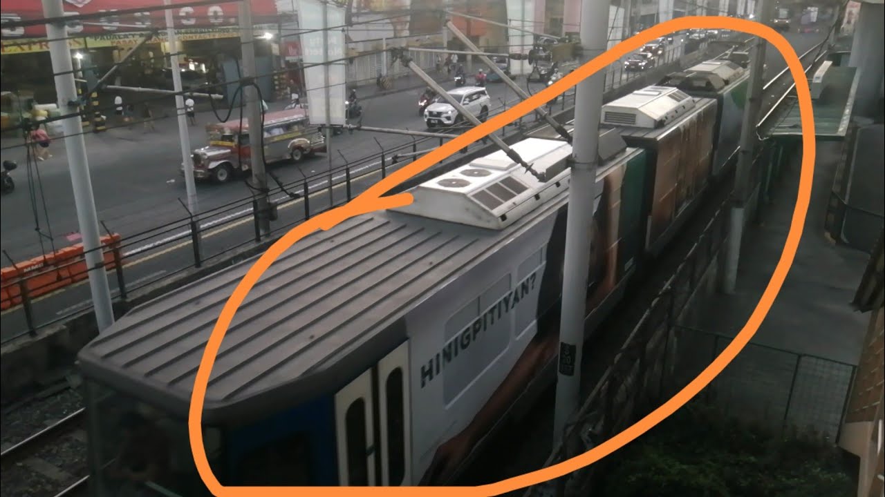 MRT-3 train with an adwrap (on rear) - departing Taft Avenue station - YouTube