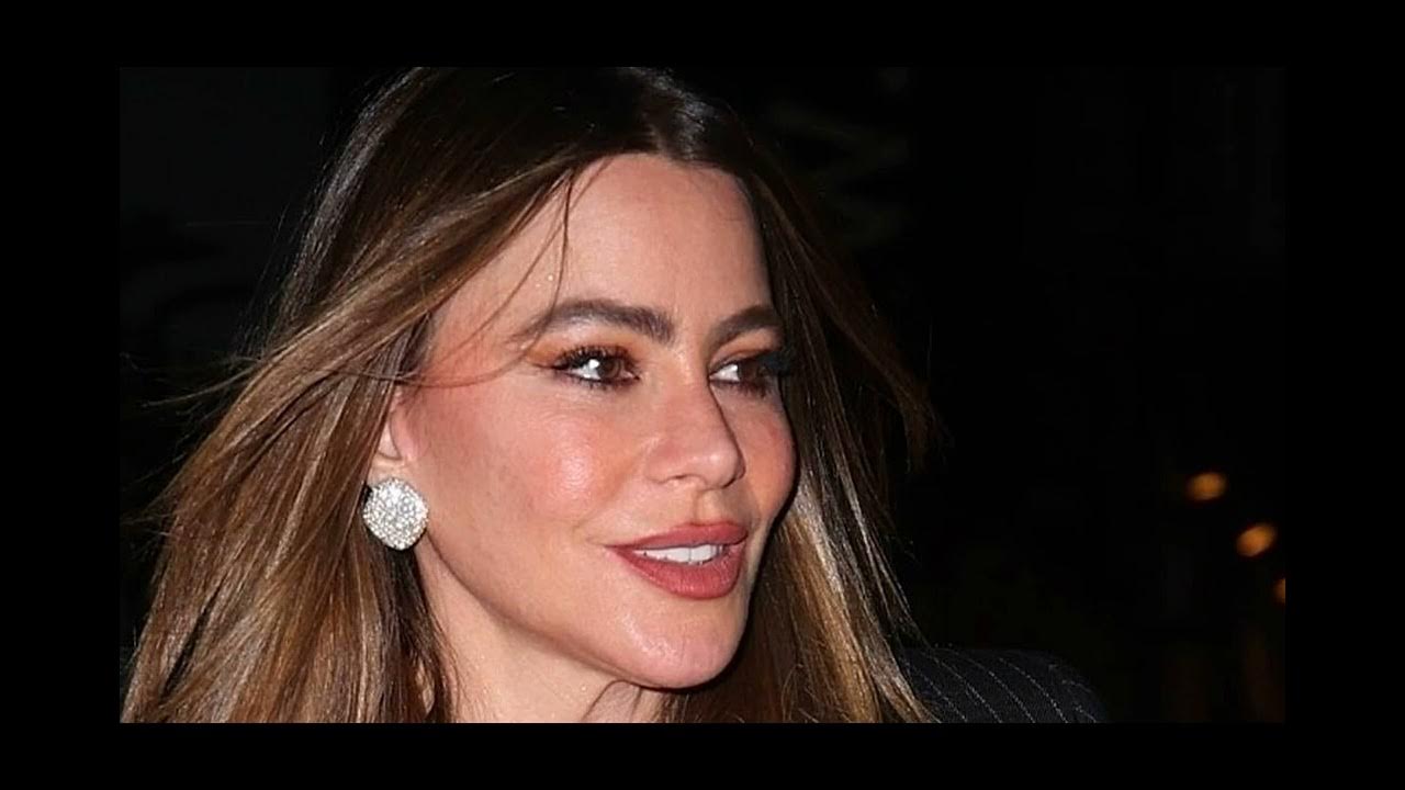 Sofia Vergara puts on a busty display in a plunging black corset and leather flares as she ...