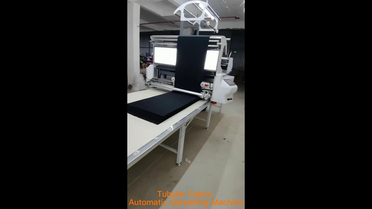 customized big size tubular fabric automatic spreading machine - YouTube