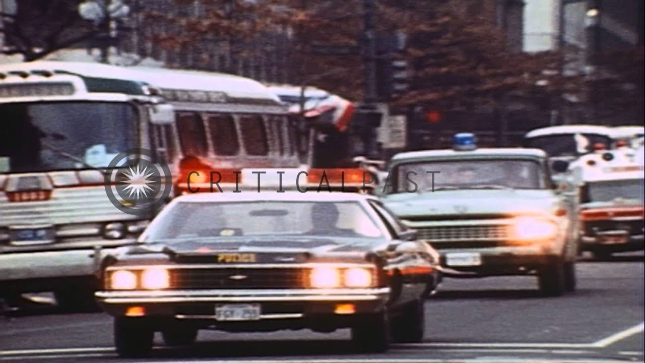 Members of high school band leave buses along a street in Washington DC ...
