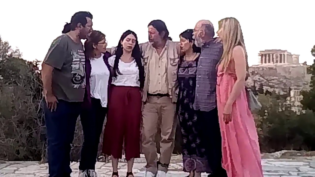 Polyphonic Ensemble "Chaonia" performing under Acropolis - YouTube