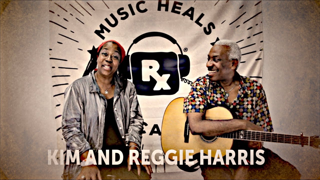 Kim and Reggie Harris perform "In the Shelter of Each Other" backstage ...