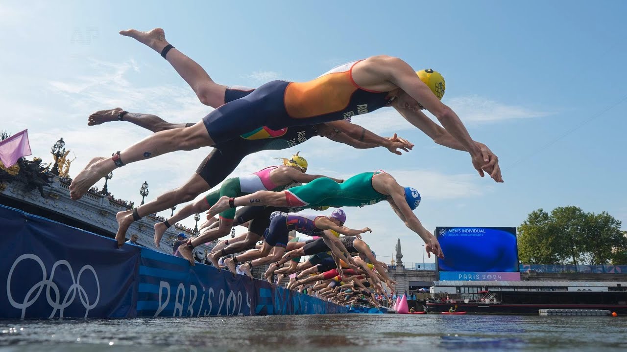 AP photographer explains what it's like capturing triathlon swimming ...