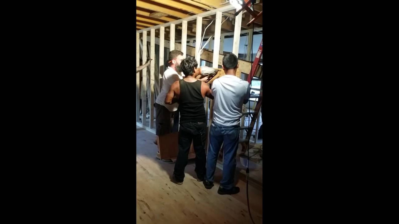 Installing steel beam for open concept - YouTube