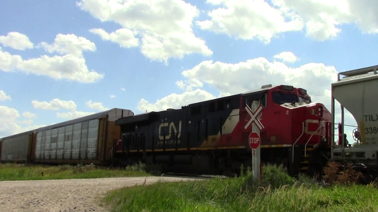Fast CN freight train with a large transformer - YouTube