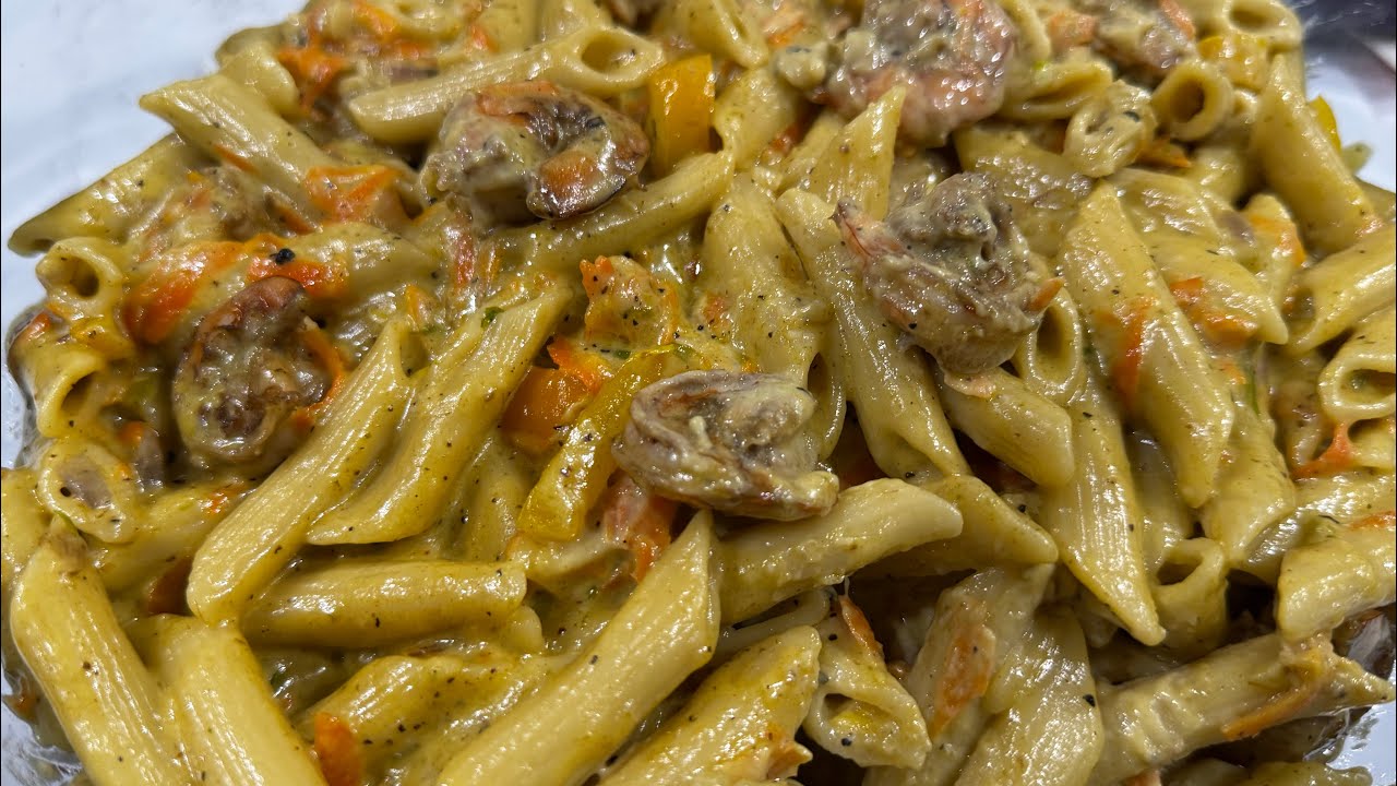 Trini Shrimp Rasta Pasta with sweet peppers and shredded carrots using ...