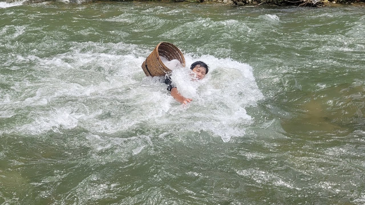 Fishing skills. Catching fish with hands. Young man swept away by water ...