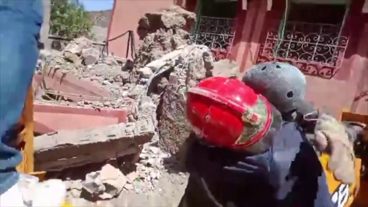 Rescuers embrace as survivor pulled from rubble following earthquake ...