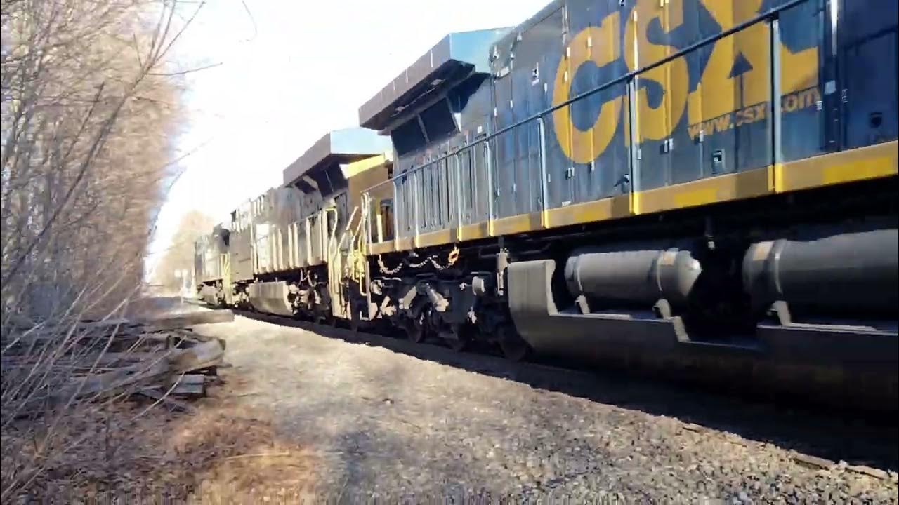 CSX M426 With rail train and old coach on the it's rear at Exeter NH train station.01/08/23 ...