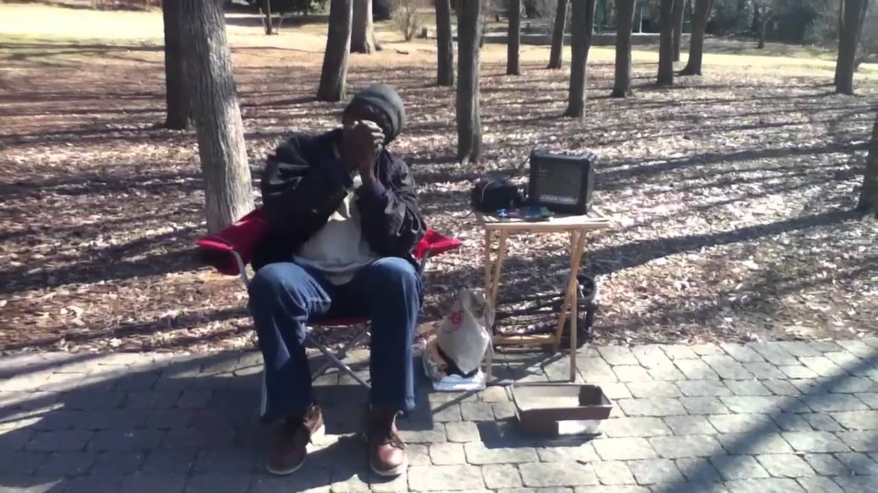 Homeless guy playing the Electric harmonica - YouTube