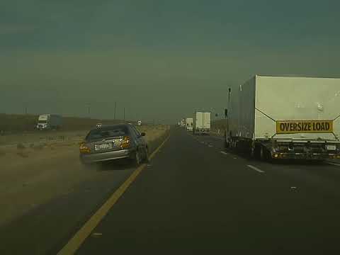 Tesla Model 3 hits huge semi truck tire tread