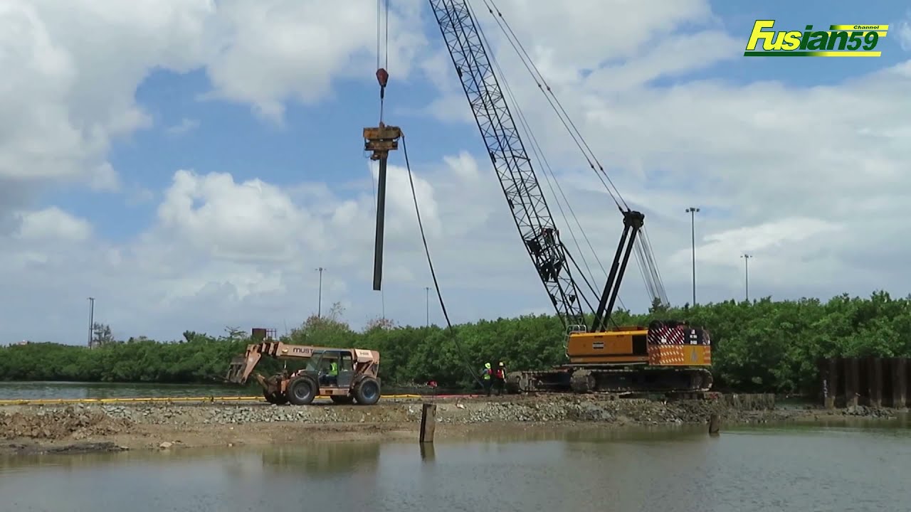 Sheet Pile Installation Work Involves Cranes and Forklifts - YouTube