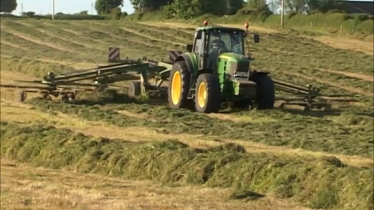 John Deere 7430 with Krone 4 rotor rake - YouTube