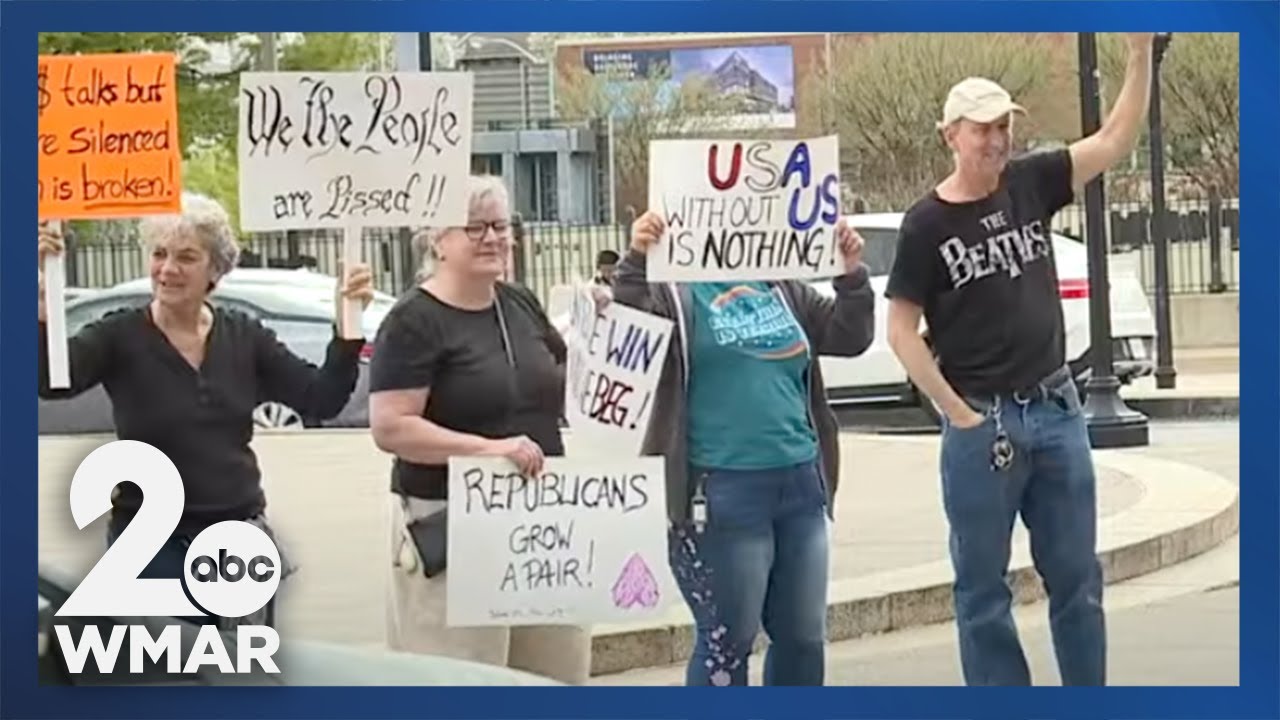 Federal workers protest against layoffs at Penn Station - YouTube
