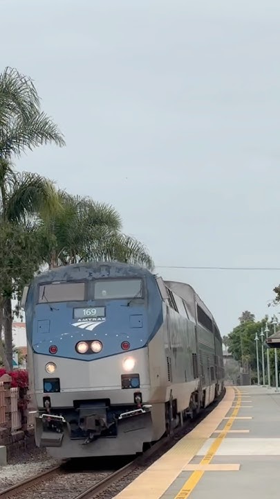 Rare! P42 169 leads Pacific Surfliner 566 through Carlsbad Village with a nice horn - YouTube