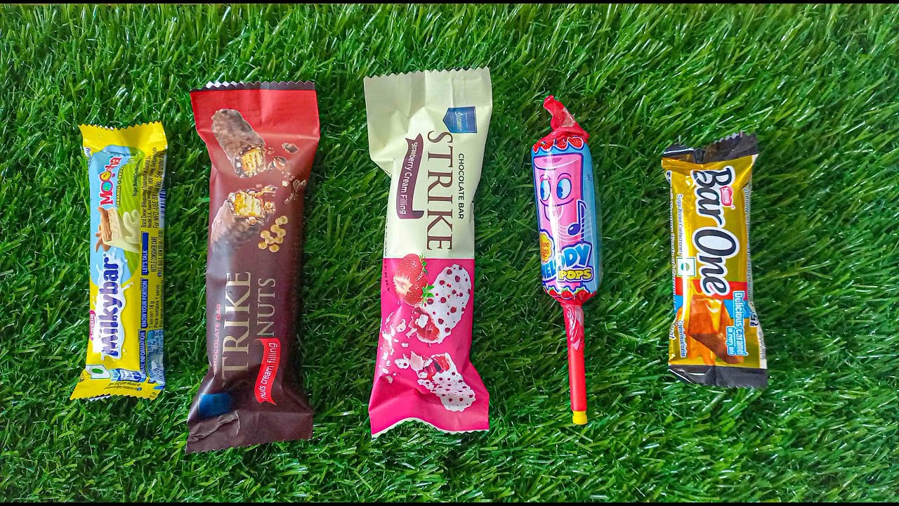 Satisfying ASMR sound of chocolates and candys. Lolipop, Snicker ...