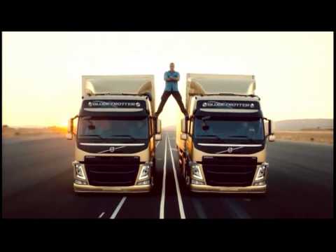 5158SB JEAN-CLAUDE VAN DAMME PERFORMS SPLITS STUNT BETWEEN TWO MOVING TRUCKS