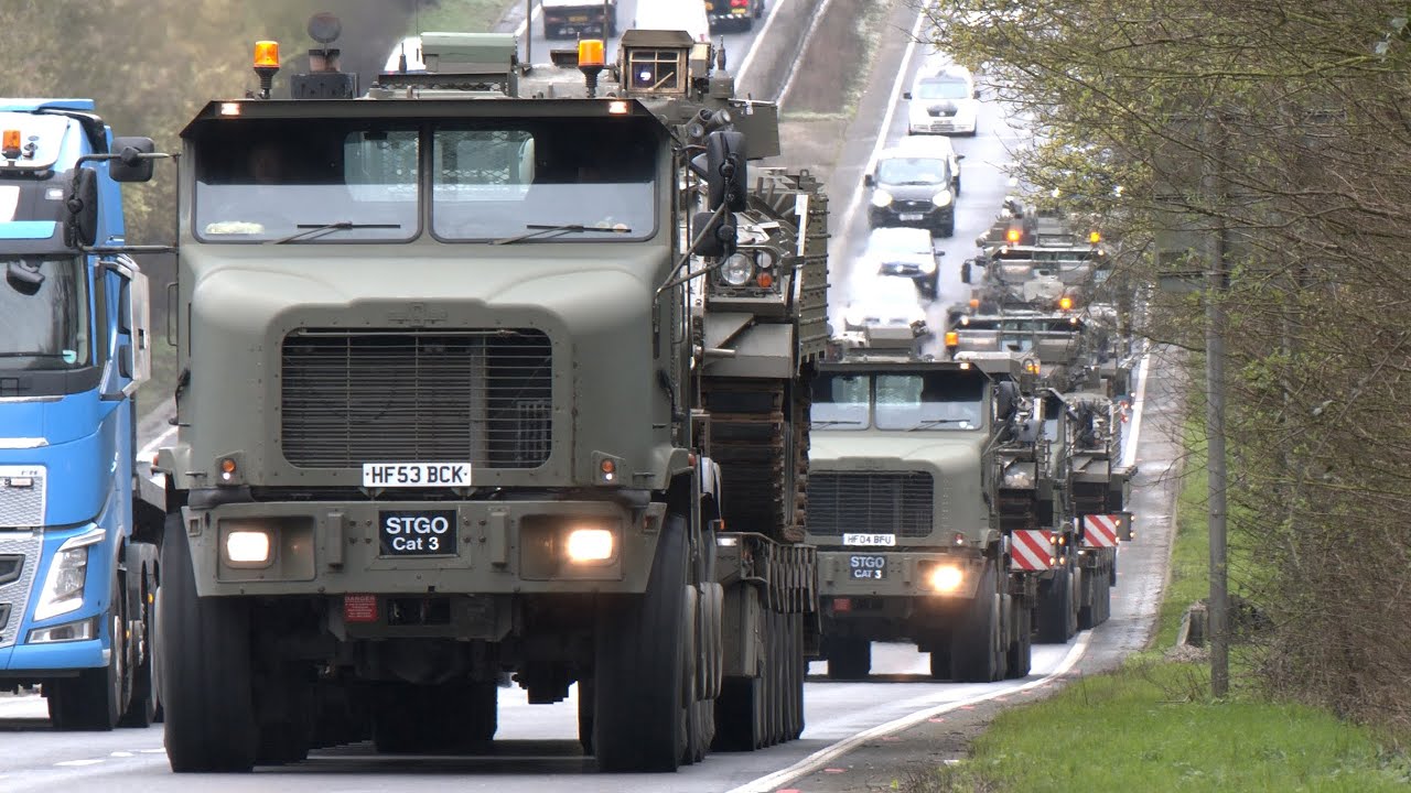 Convoy of tank transporters hauling Up-Armoured Fighting Vehicles of ...