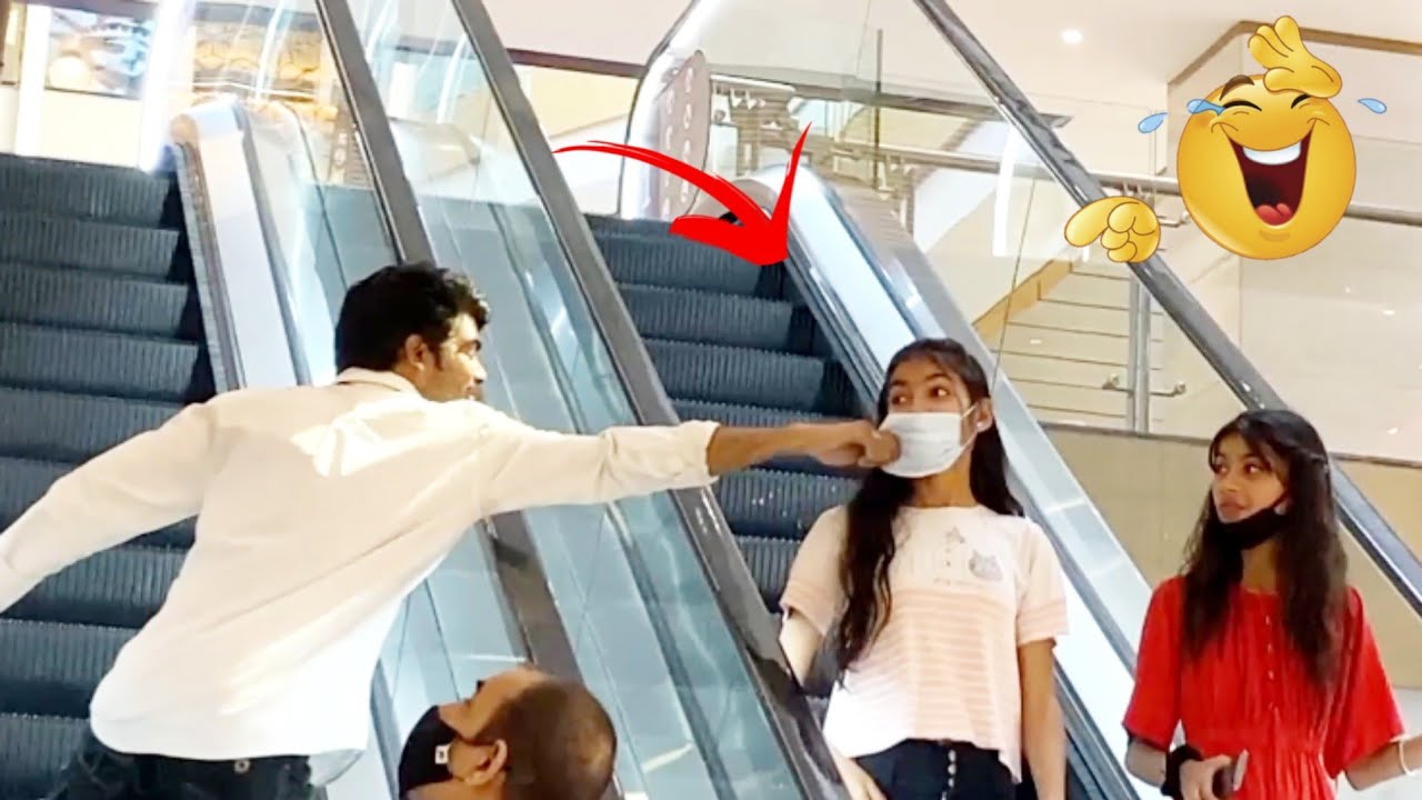 pulling strangers cheeks 😂 on escalator | epic reaction - YouTube
