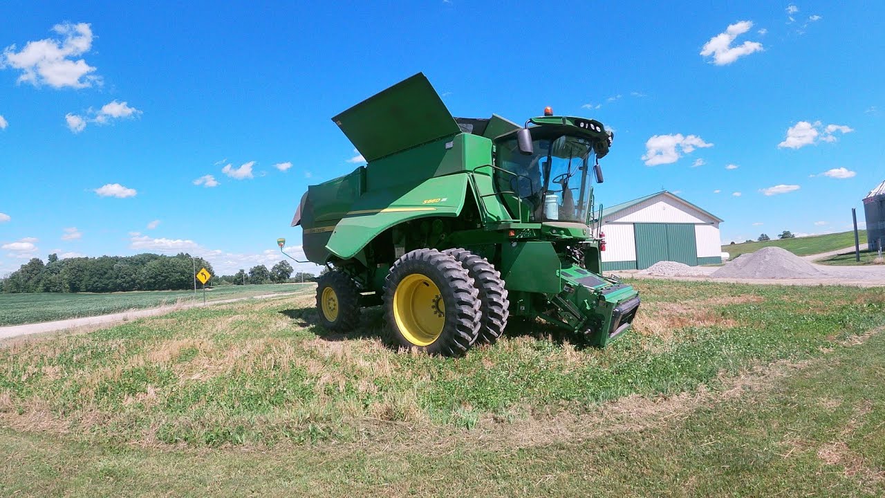 Blowing chaff off combine. - YouTube