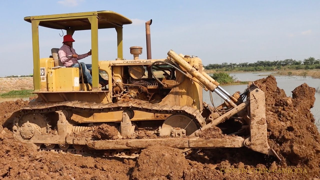 Powerful CATERPILLAR Bulldozer And Stronger Dump Truck Working to ...