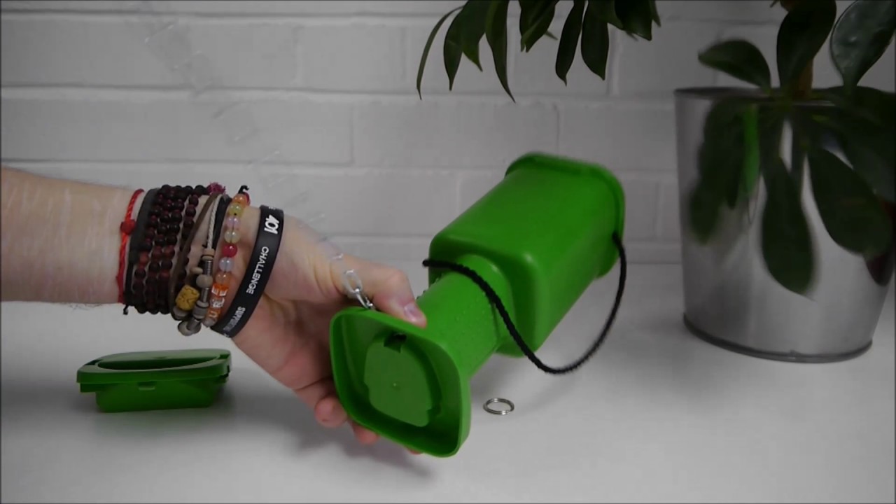 Inserting a Security Chain into a Hand Held Charity Collection Box ...