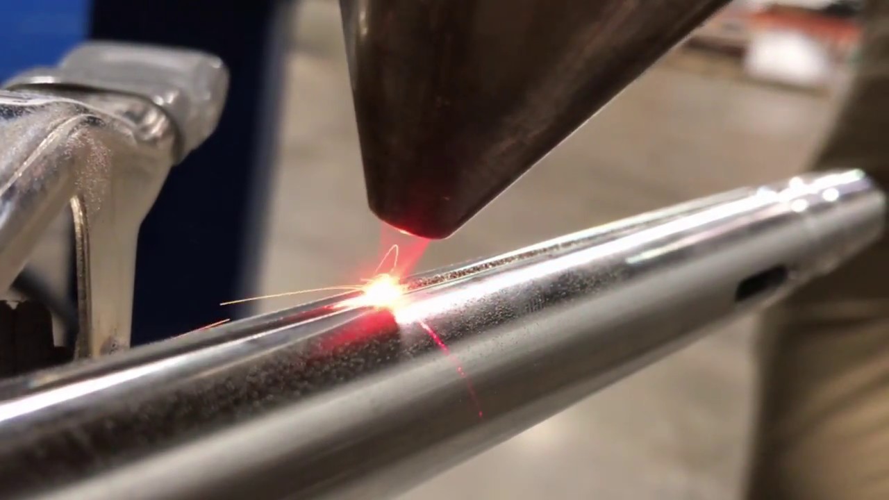 Laser metal deposition for embedding components in industrial ...