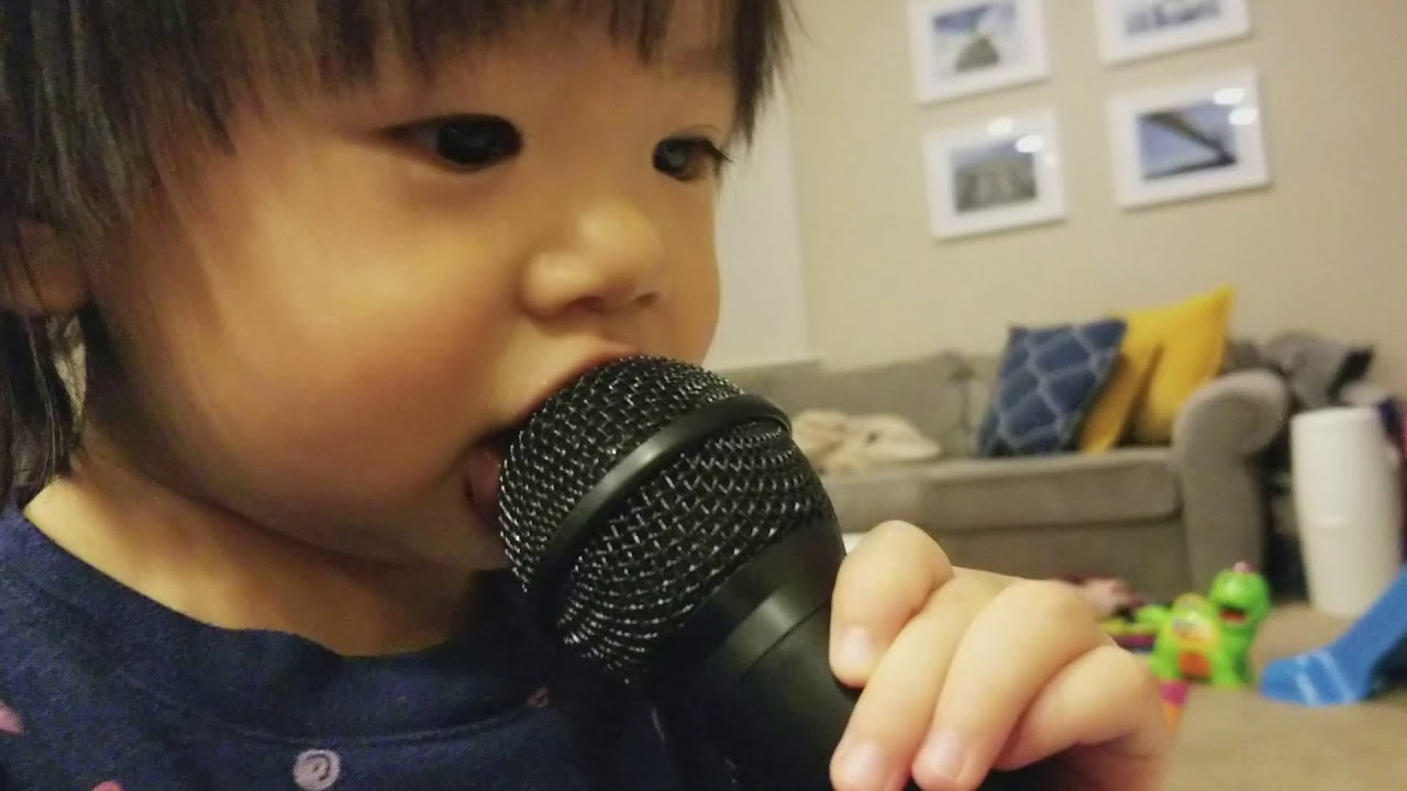 Baby cha cha eating the microphone funny singing style - YouTube
