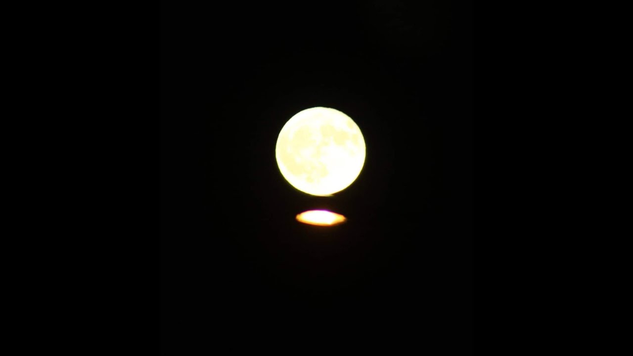 Moon Rising Over Street Light - YouTube