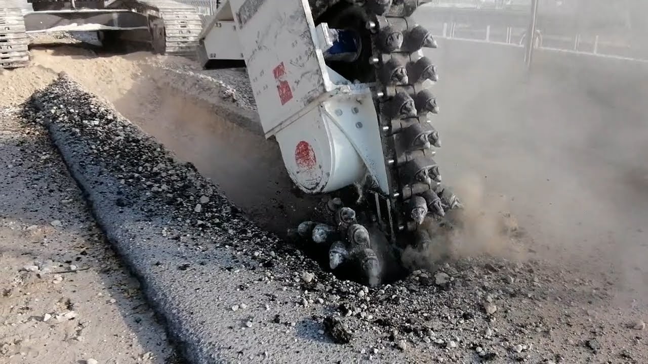 Trenching with a KEMROC chain cutter - YouTube