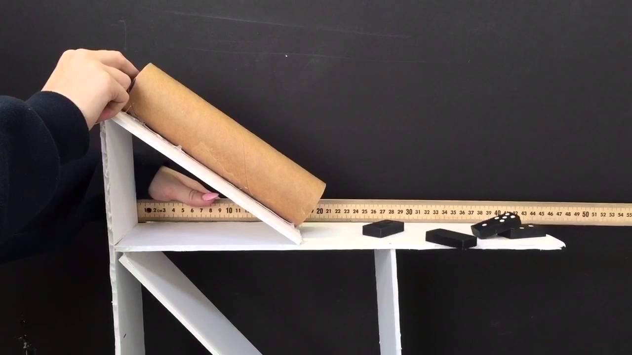 Rube Goldberg Machine - Knocking over dominoes - YouTube