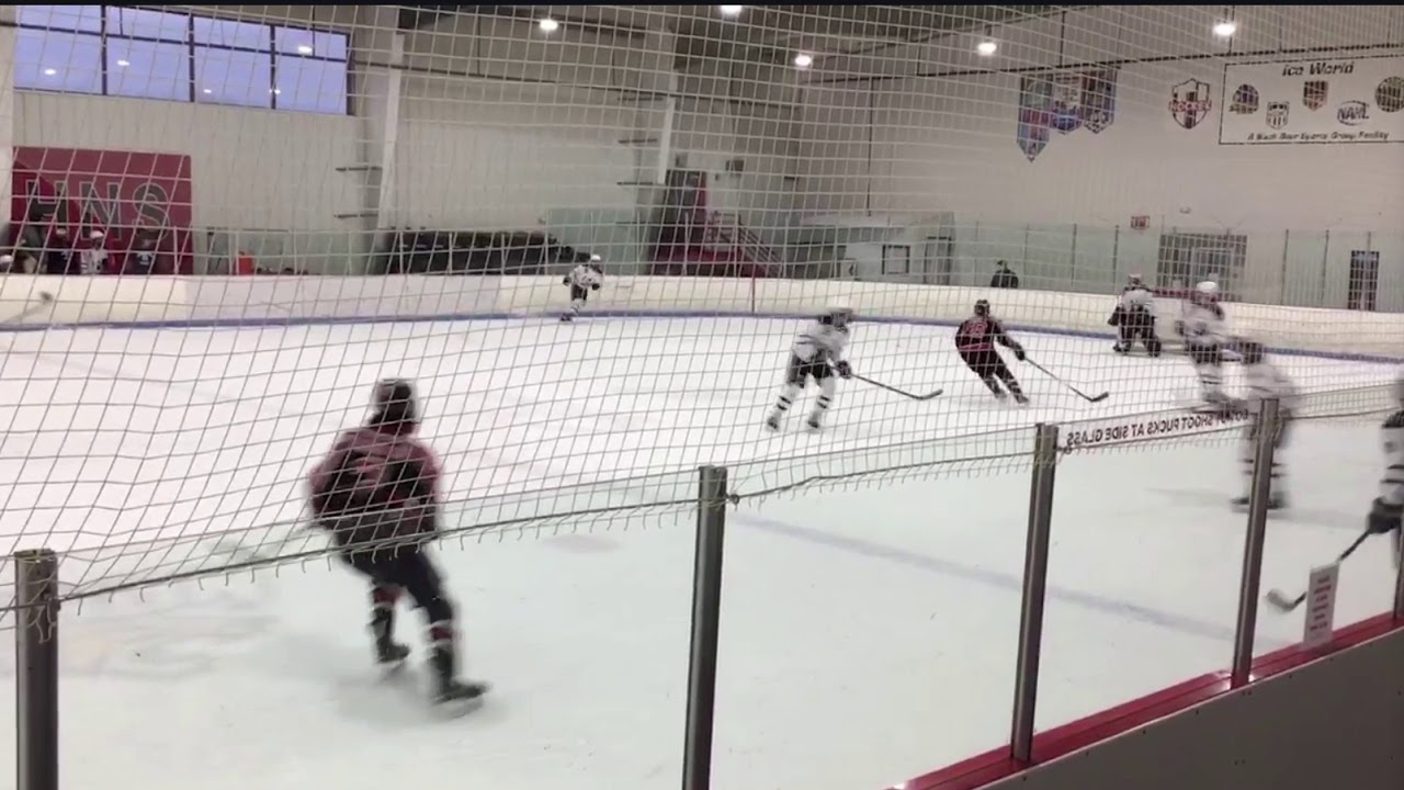 Josh Testerman, #21 16U TI Selects forward, throws a hit and splits the ...