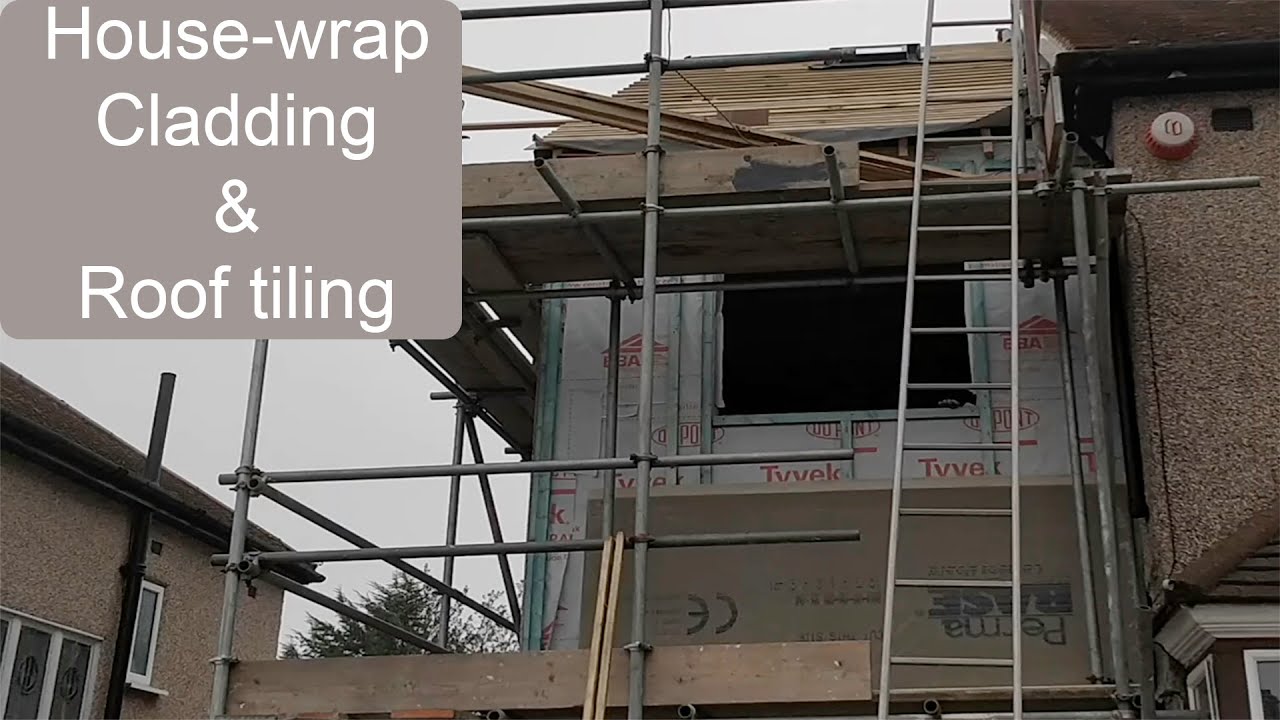 Putting up the Tyvek House wrap, render carrier board and tiling the ...