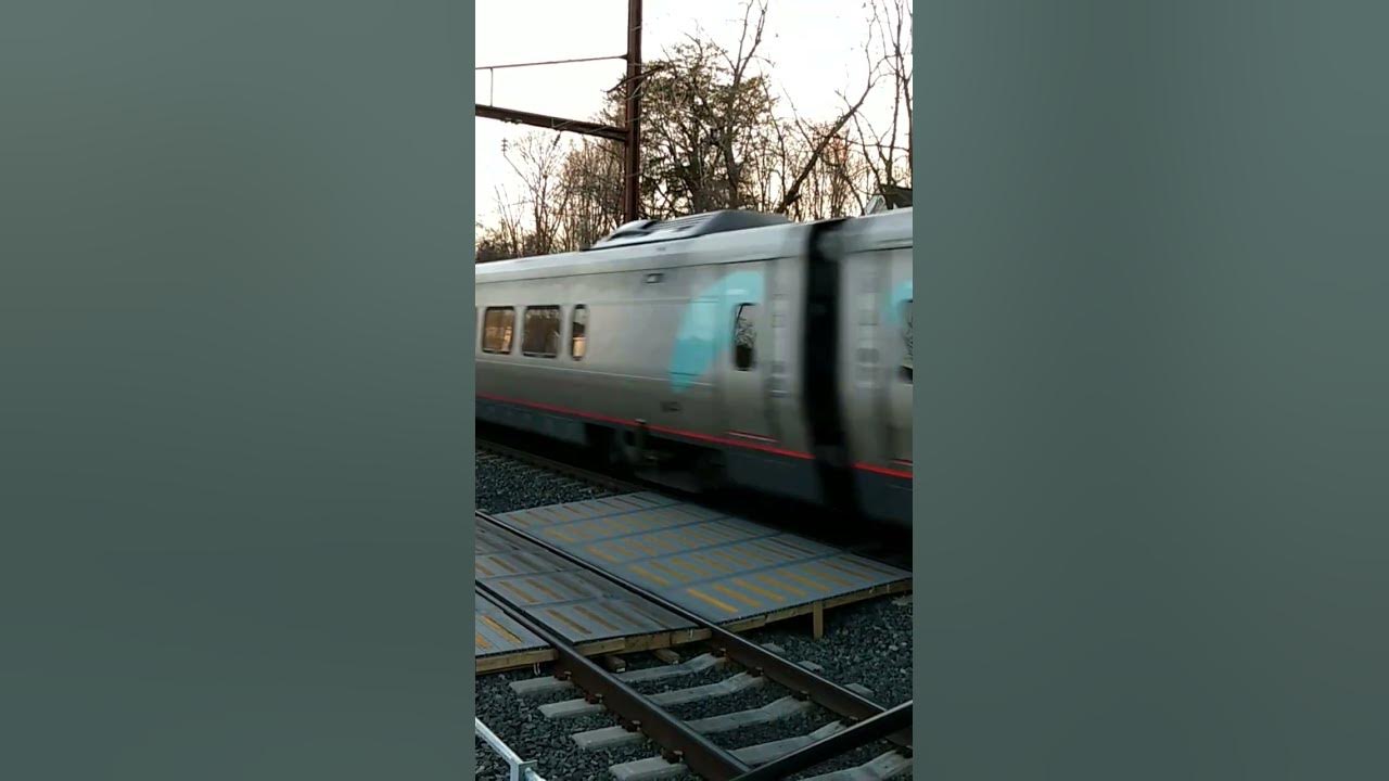 Amtrak Acela passes MARC train - YouTube