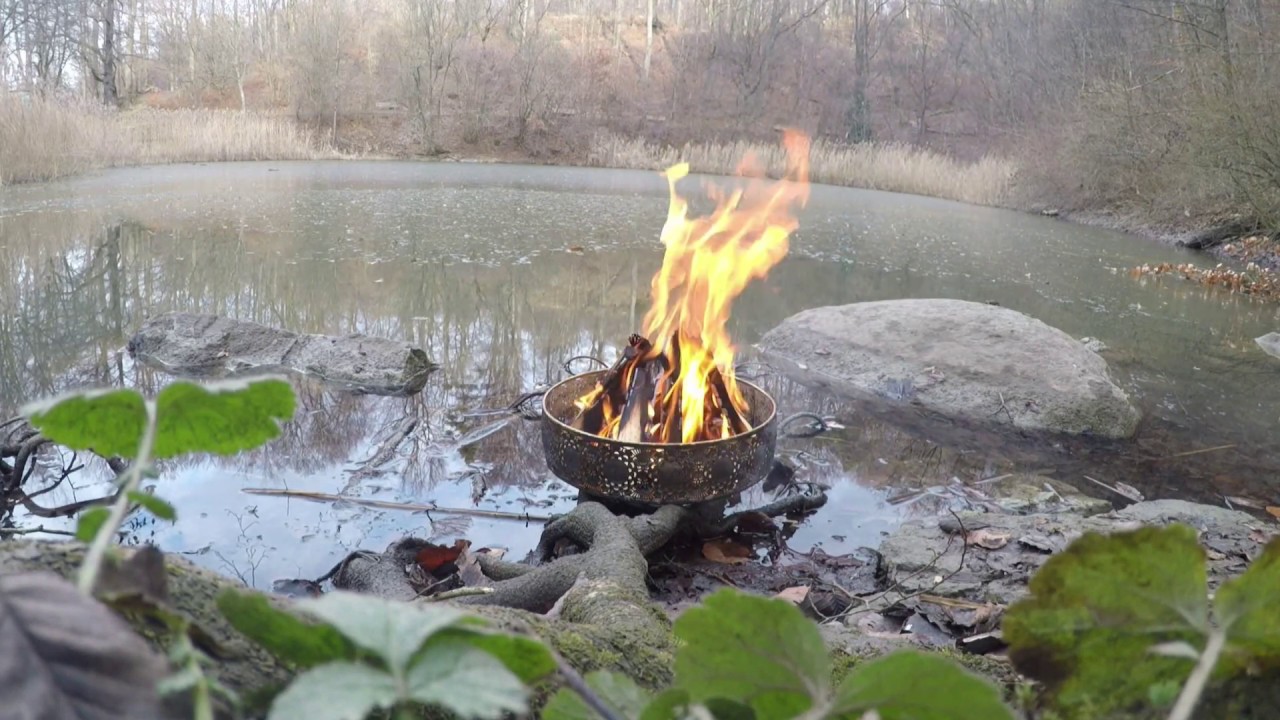 cosy fire in front of a pond. - YouTube